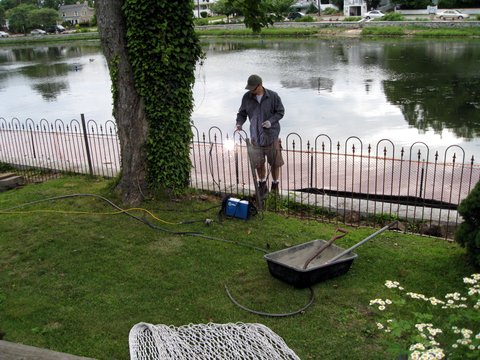Customer Installing our No-Dig Fencing