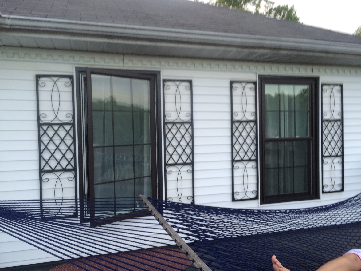 House Metal Window Shutters On Customer's Home