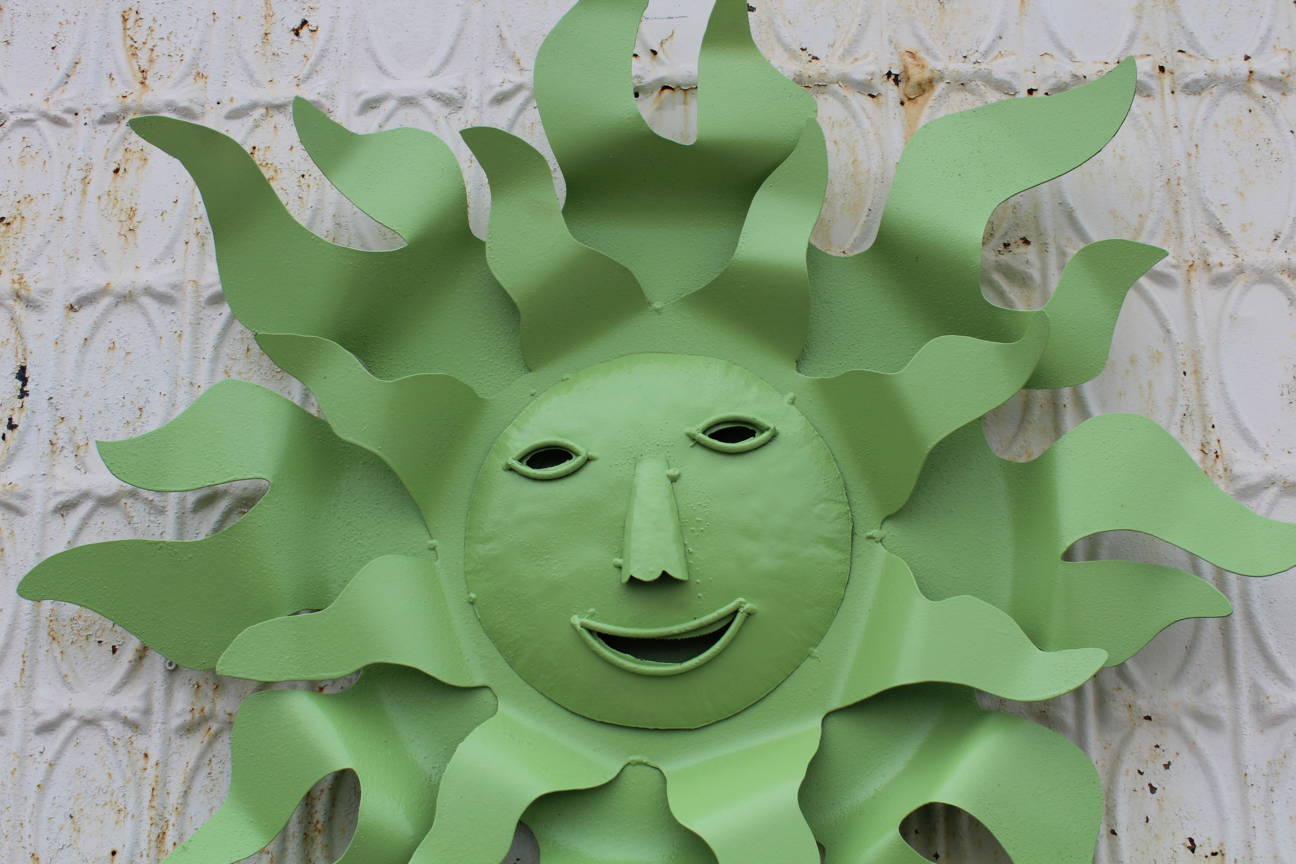 Large Metal Sun with Face Design