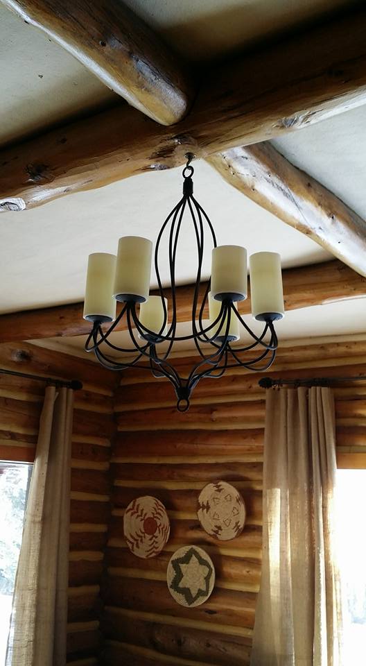 Tamara Candle Chandelier Installed in a Log Cabin