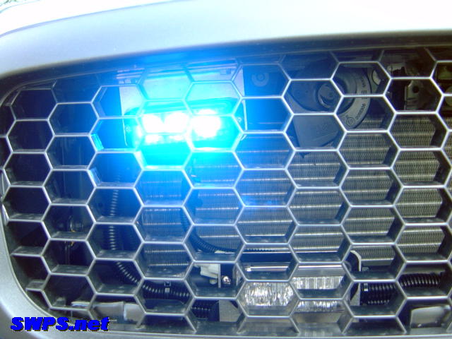Whelen TIR-3 installed behind grille of Ford Police Interceptor from ...