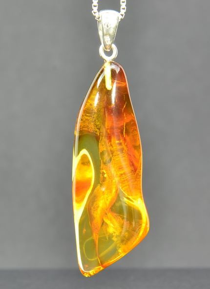 Baltic Amber Amulet Pendants Made of Tall Free Form Cognac Amber.