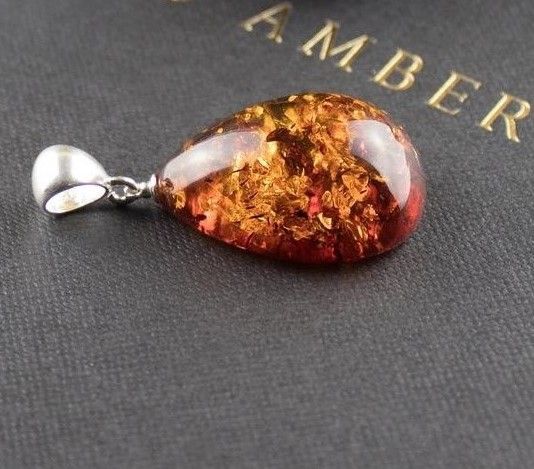 Baltic Amber Pendants [Amber Artisans Studio].