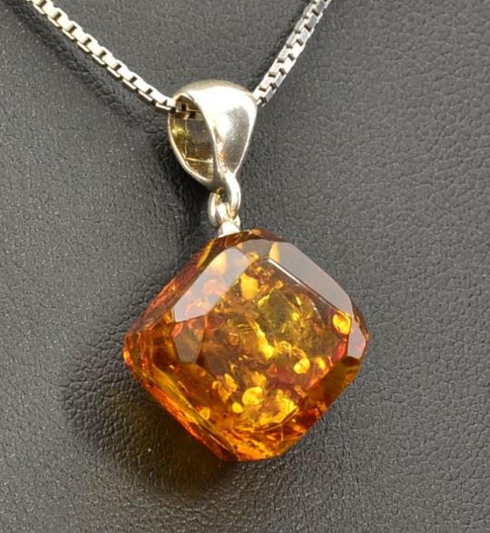 Faceted Amber Cube Pendant Made of Cognac Baltic Amber.