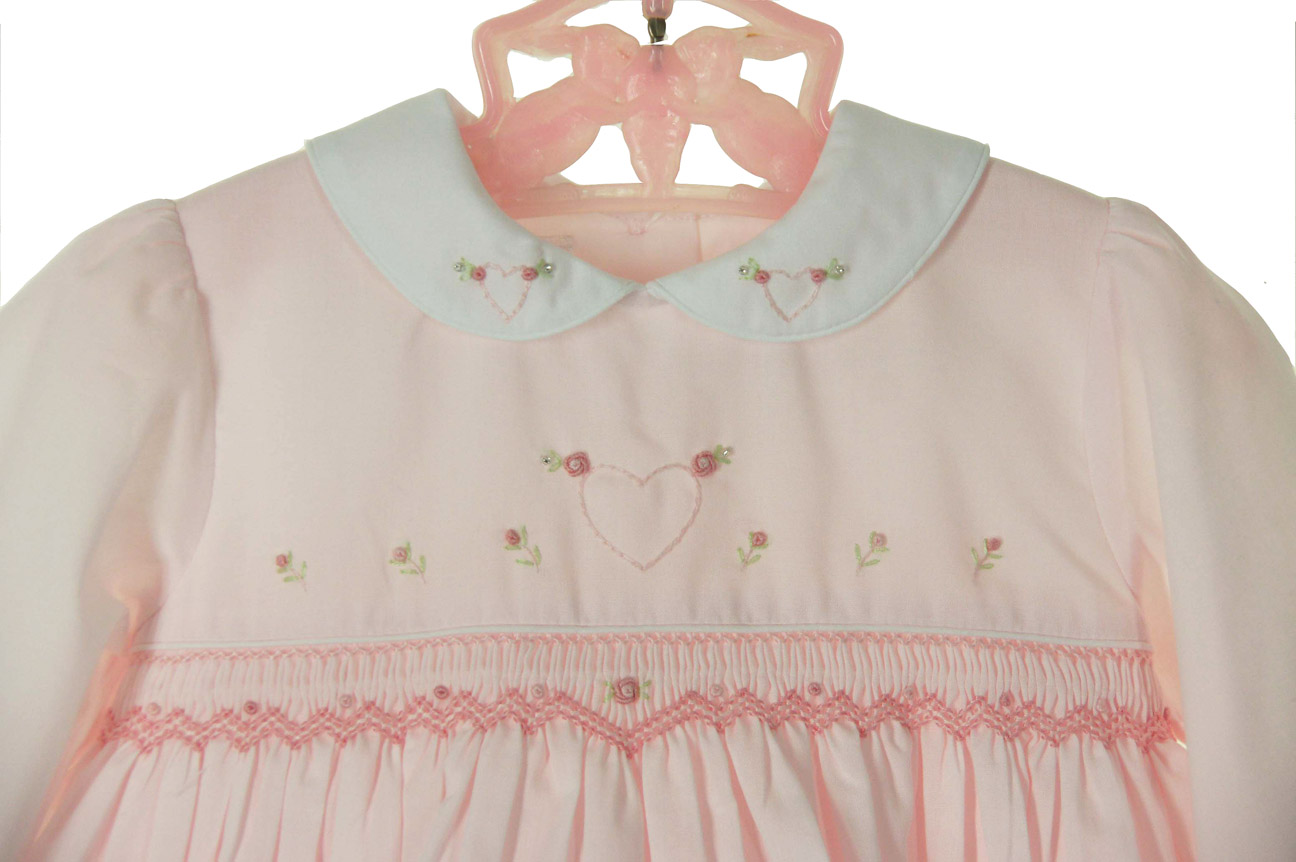 Sarah Louise pink smocked dress with heart and rosebud embroidery