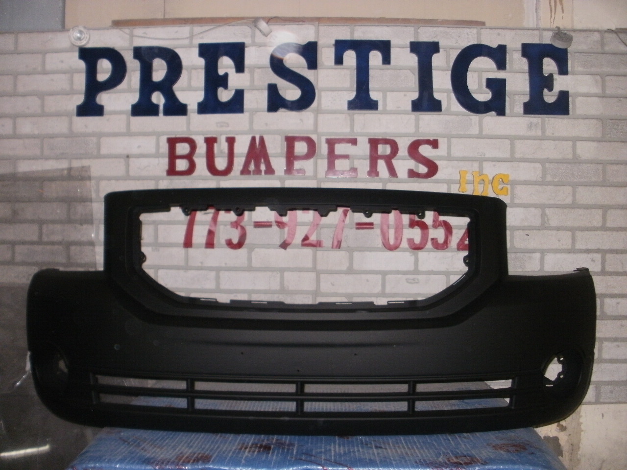 2007-08 DODGE CALIBER FRONT BUMPER COVER W/FOG LIGHT HOLES