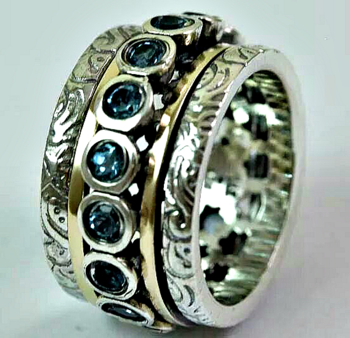 Israeli jewelry Spinner ring Blue Topaz silver and gold