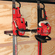 Holds a Hedge trimmer and chainsaw by their loop handles for enclosed ...