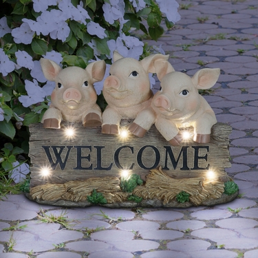 Solar Pigs On Welcome Log only $59.95 at Garden Fun